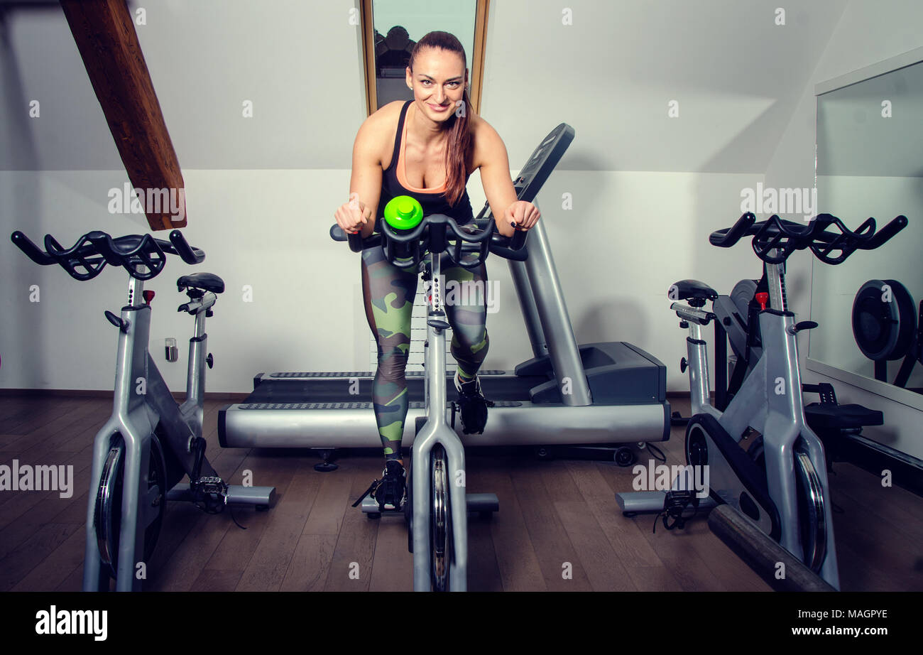Woman exercise bike gym intense hi-res stock photography and images - Alamy