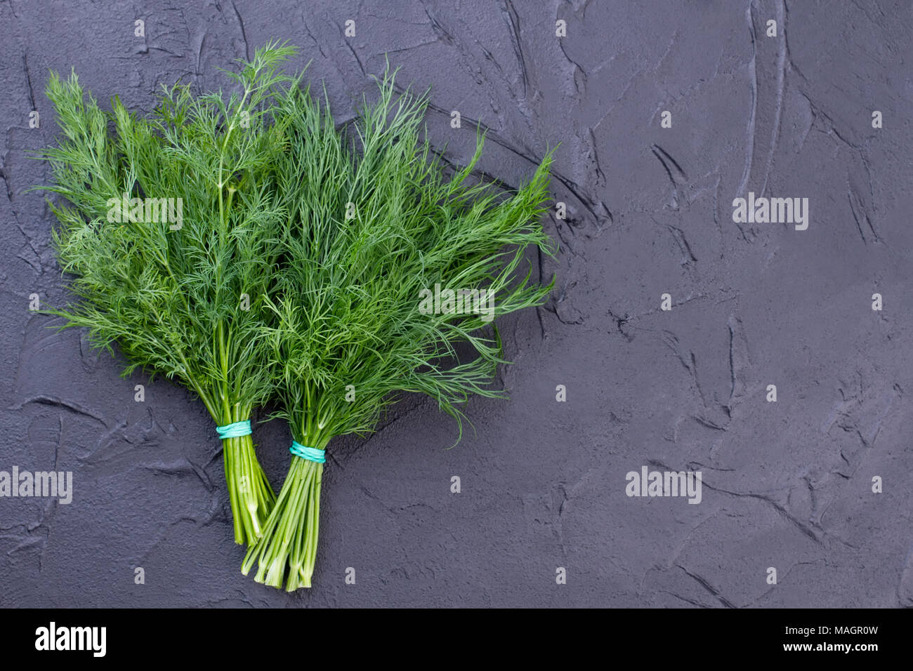 Fresh green dill, copy space. Bunches of garden dill on slate tray ...