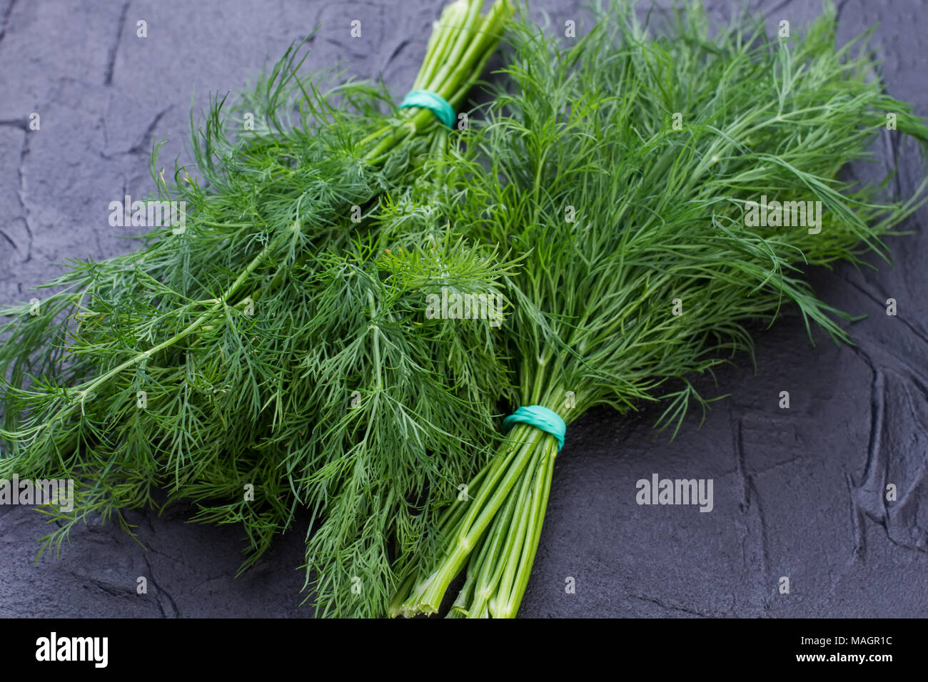 Fresh dill on slate background. Organic herb on black slate plate ...