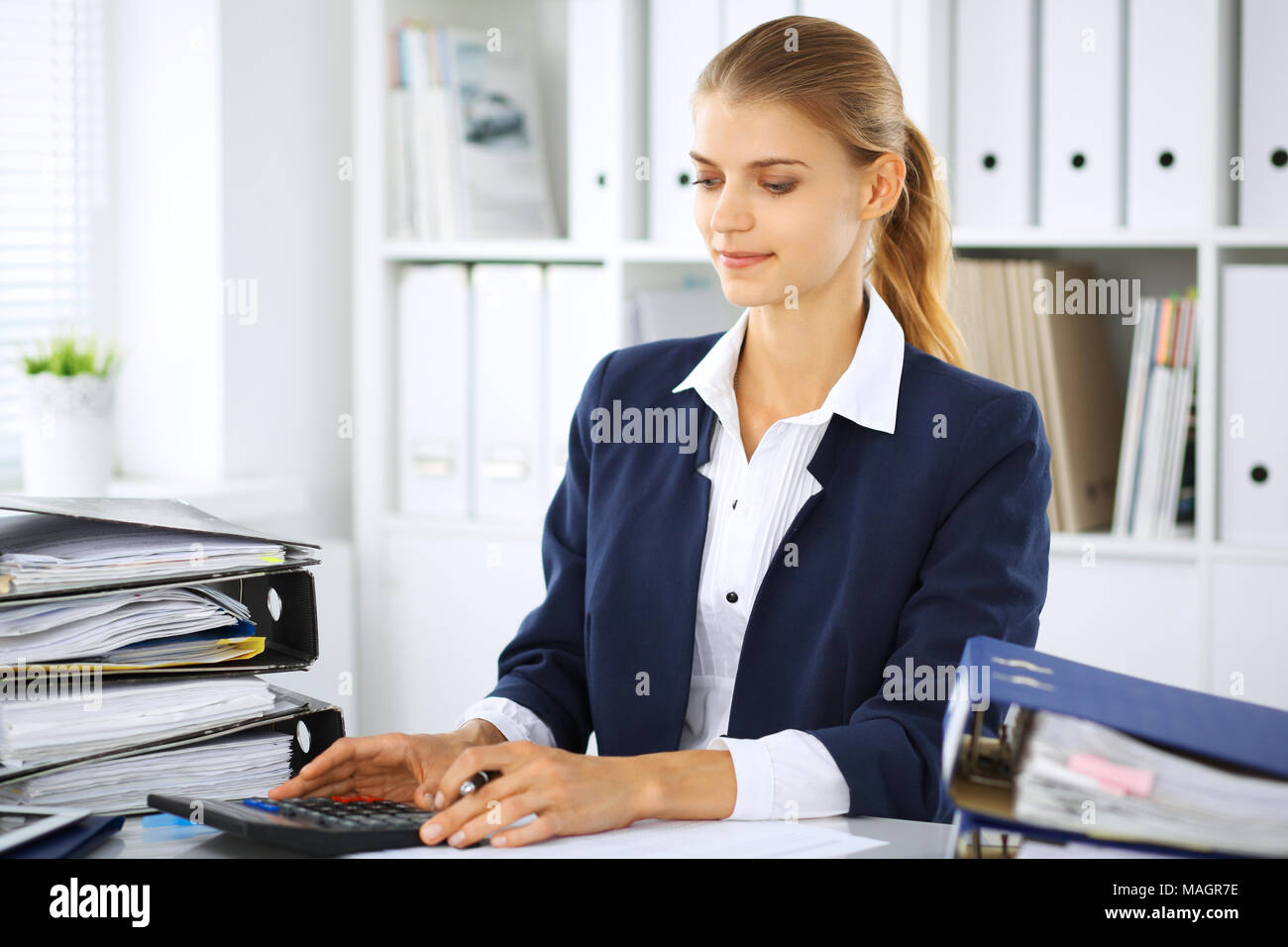 Modern business woman or confident female accountant in office. Student ...