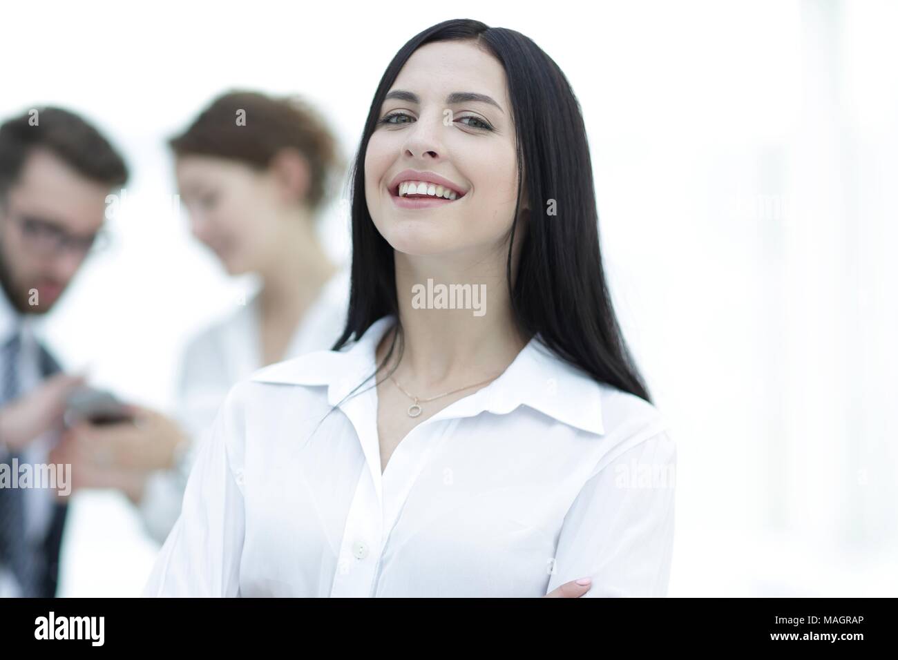 close-up of a beautiful woman manager and co-workers in the office ...