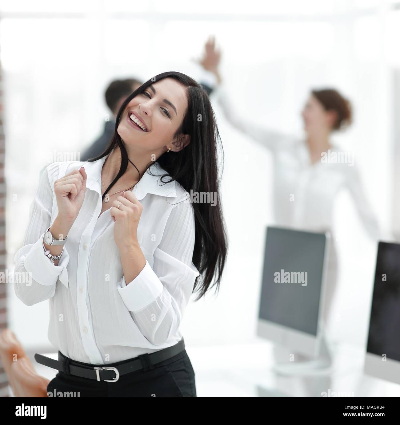 happy young business woman on a blurred office background Stock Photo ...