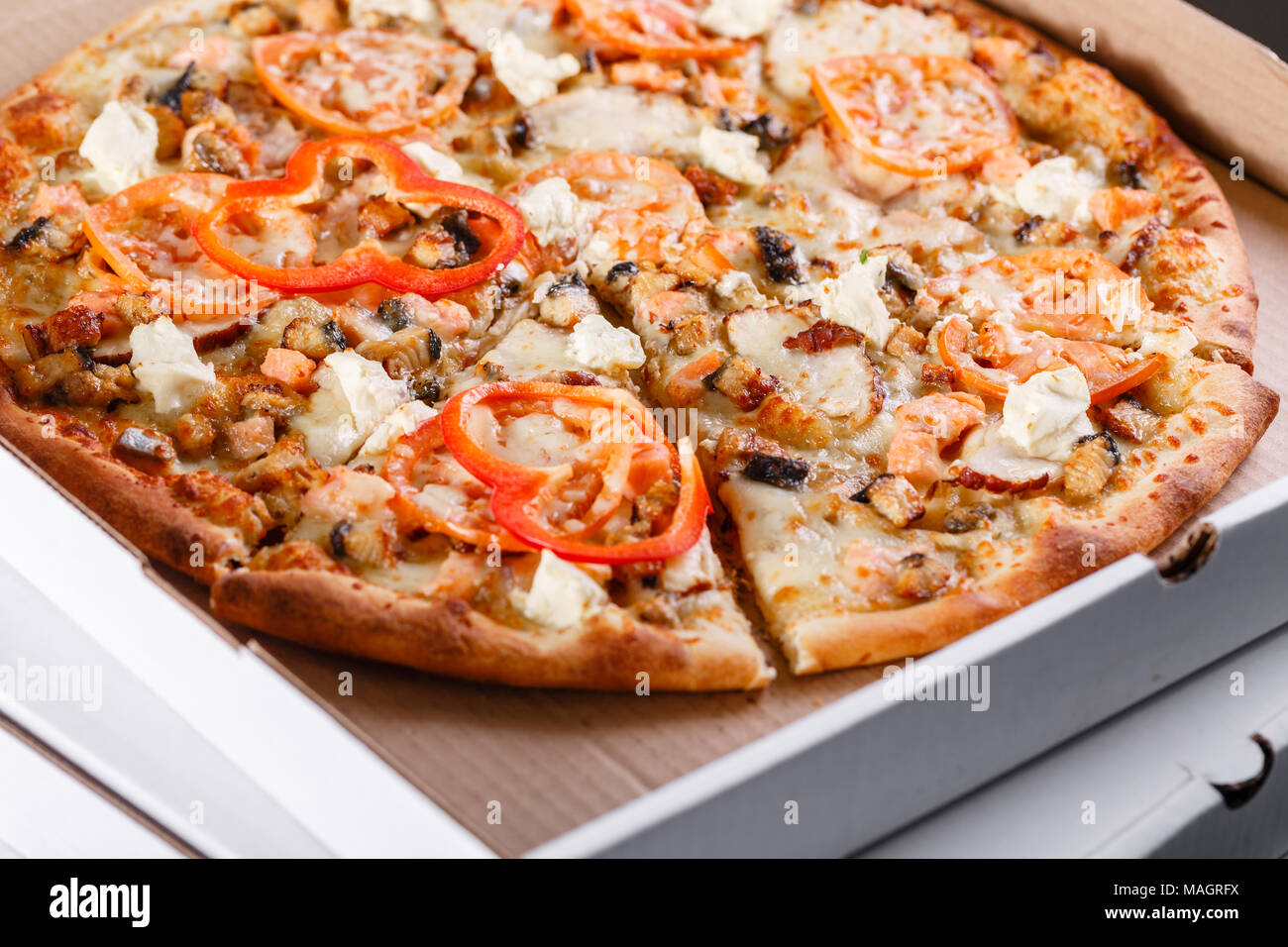 Pizza box delivery concept. Open box with hot tasty italian sliced ...