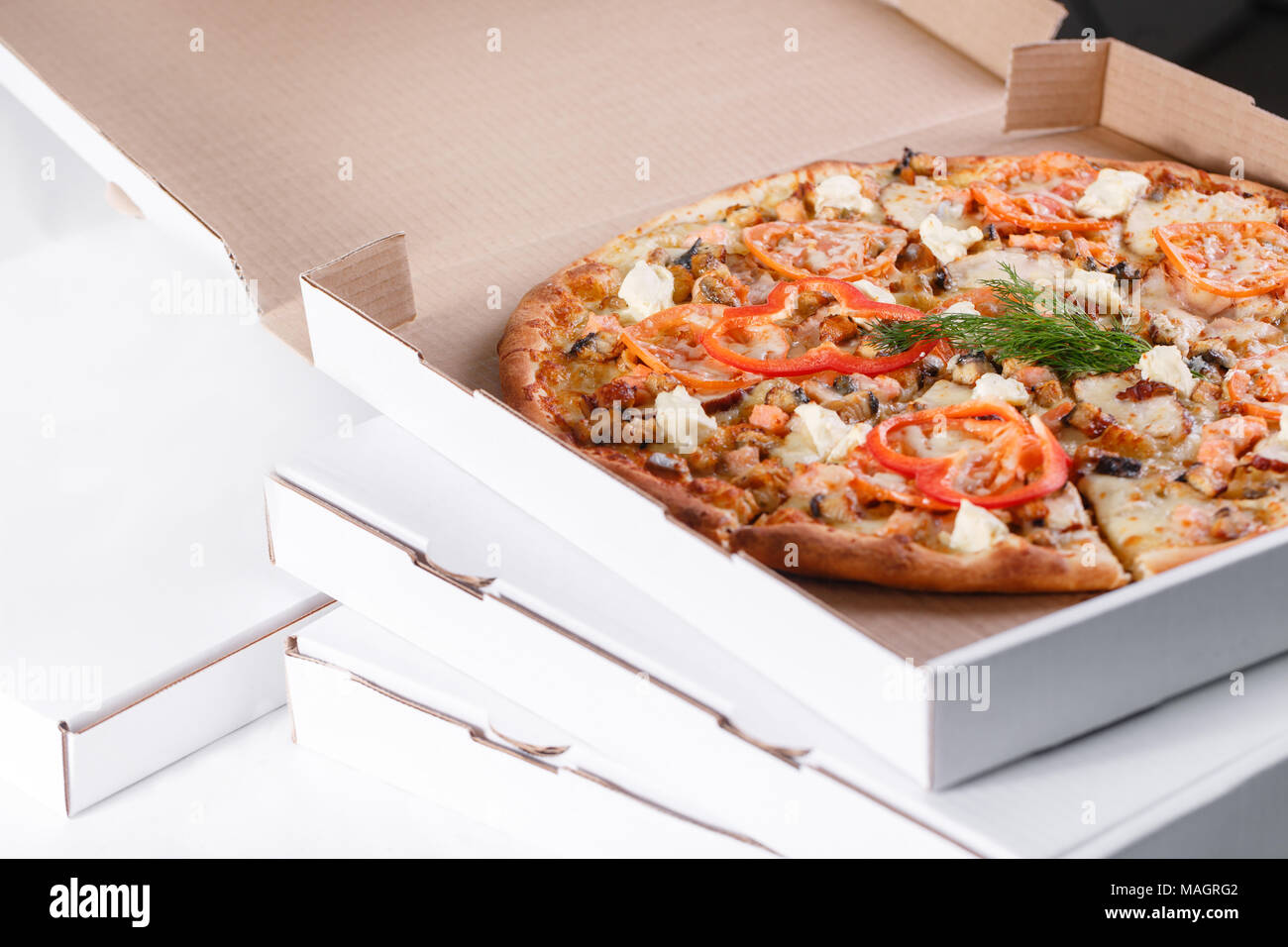 Pizza box delivery concept. Open box with hot tasty italian sliced ...