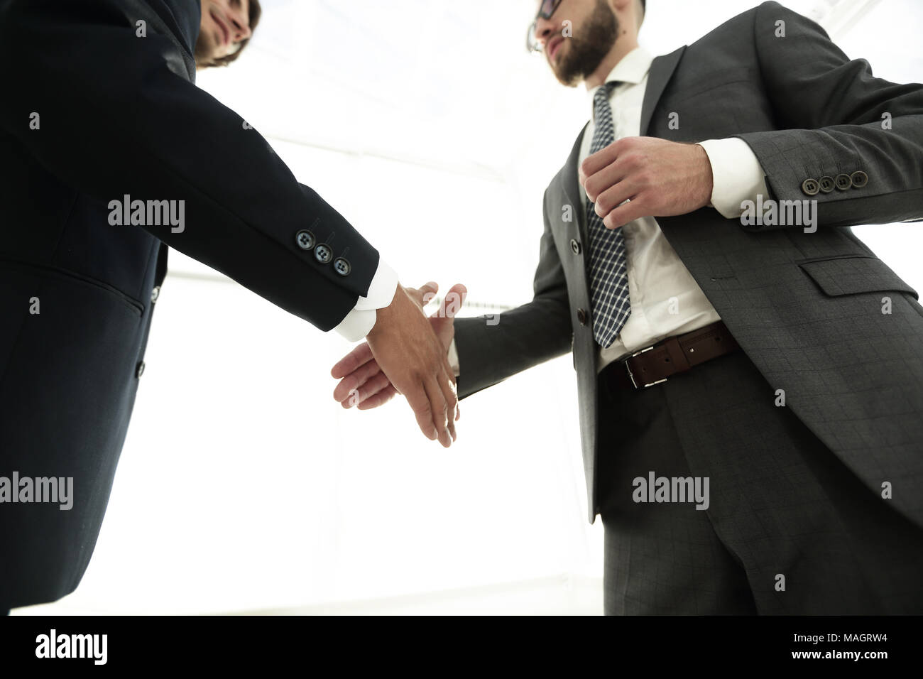 Two business men going to make handshake Stock Photo - Alamy