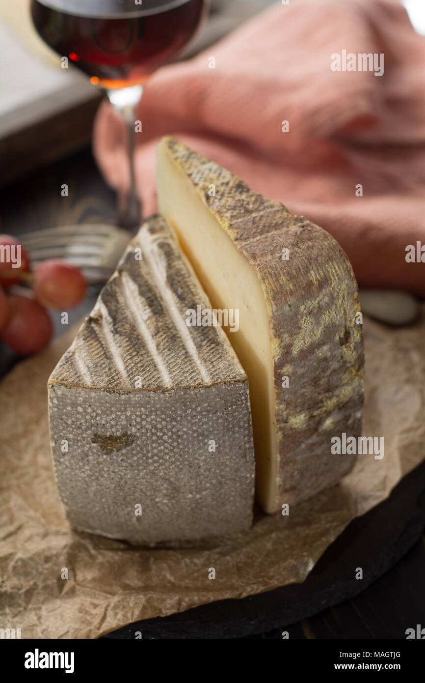 Tasting of ancient french demi soft cheese Tomme from French Alps, made ...