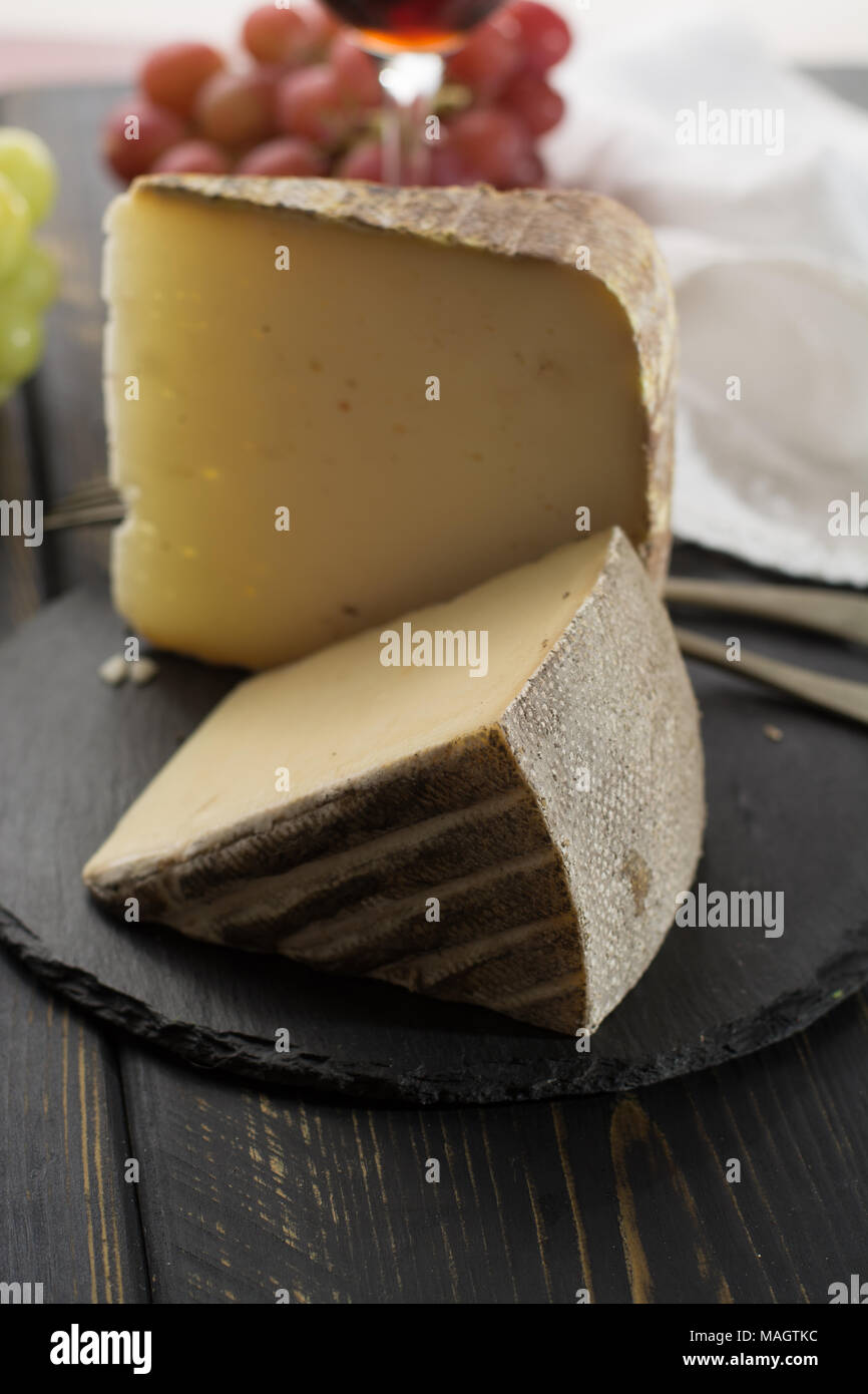 Tasting of ancient french demi soft cheese Tomme from French Alps, made ...