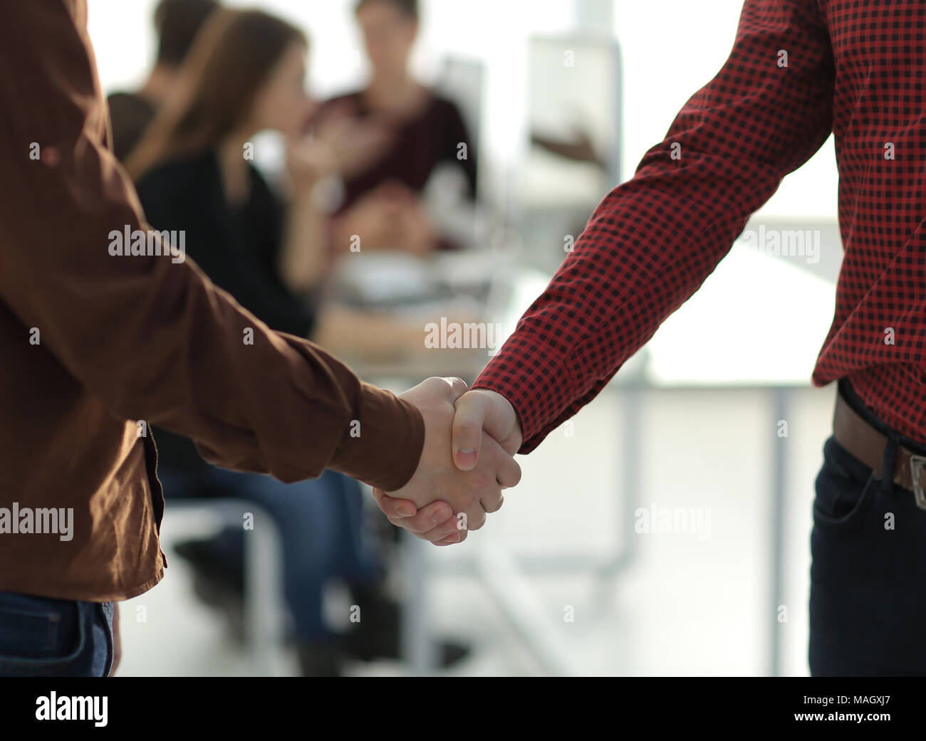 Handshake between people different hi-res stock photography and images ...