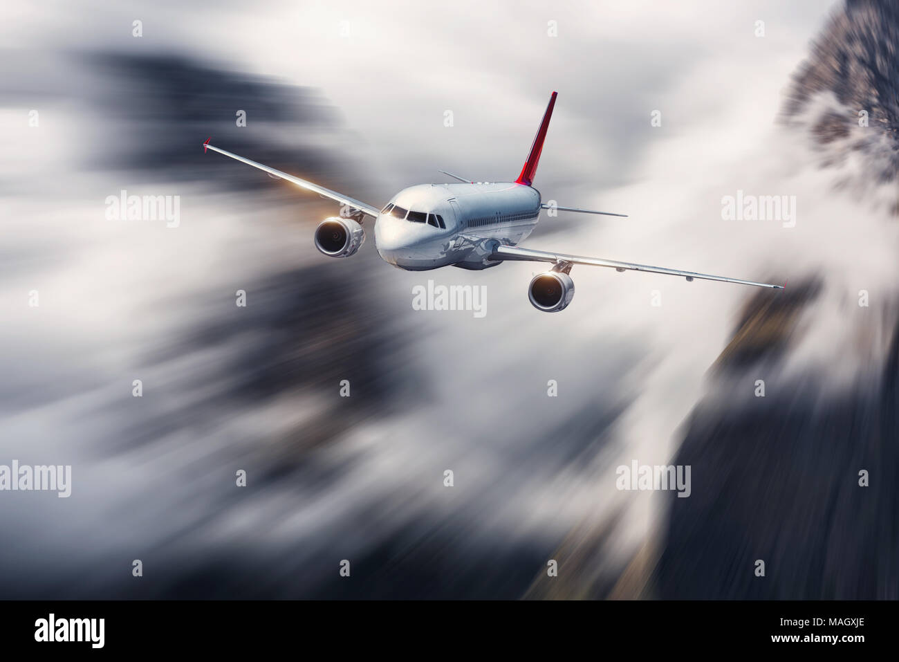 Airplane in motion. Aircraft with motion blur effect is flying in ...