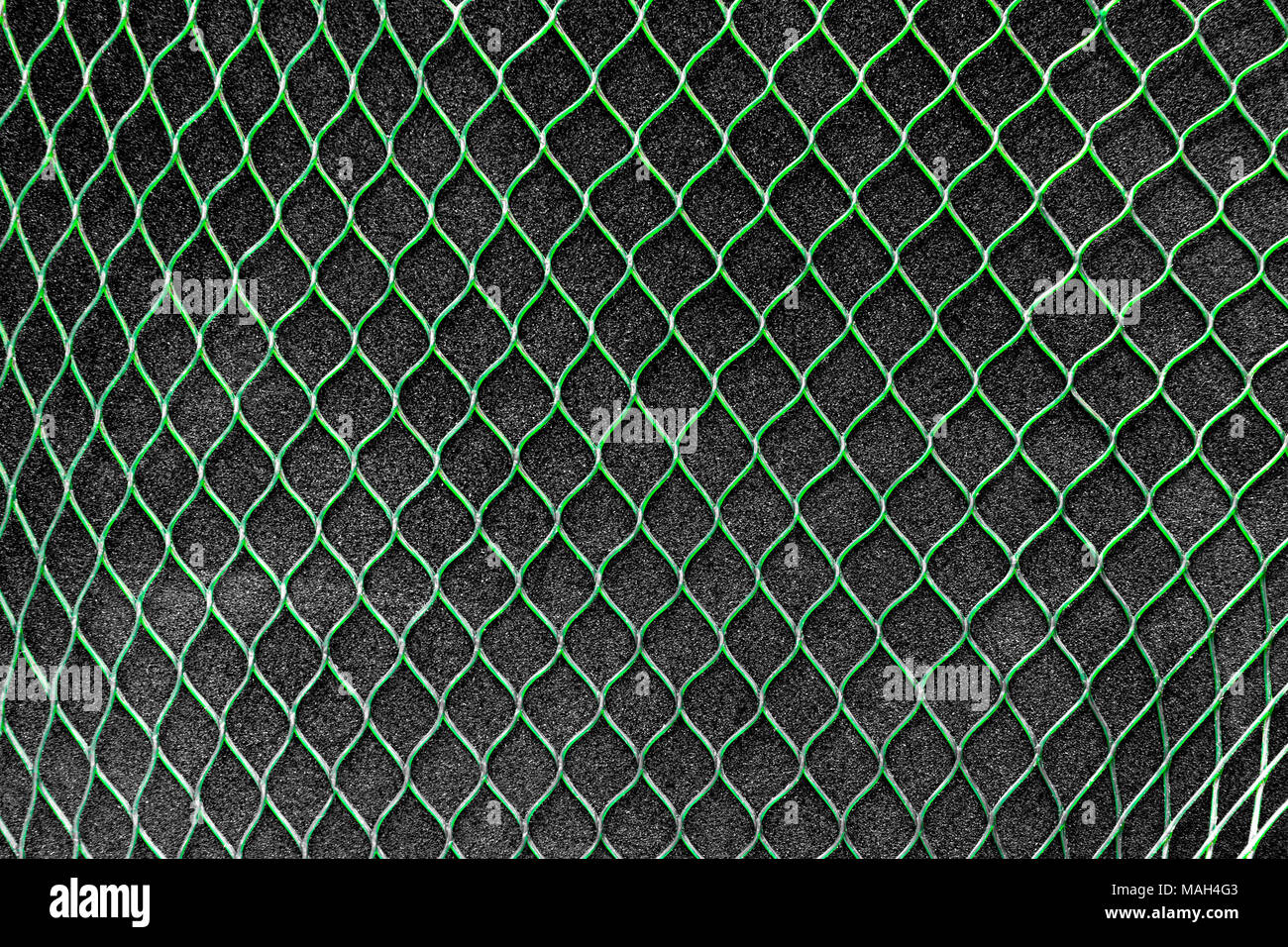 Green vertical net on the grey soft background Stock Photo - Alamy