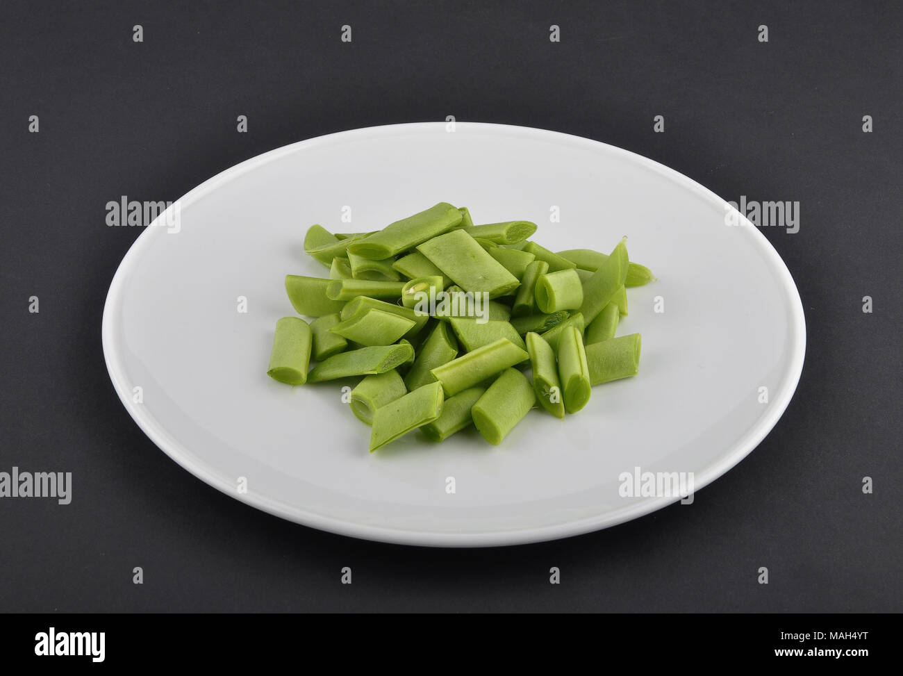 Common beans cut on plate Stock Photo - Alamy