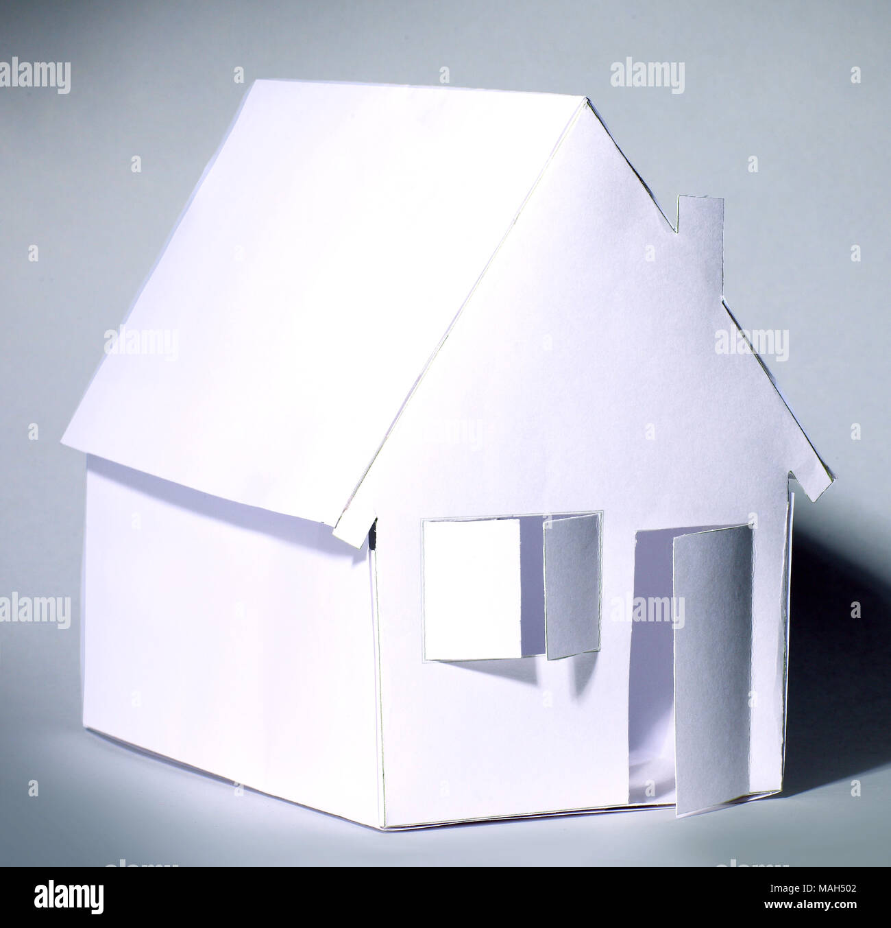 paper house with open door.isolated on grey Stock Photo - Alamy
