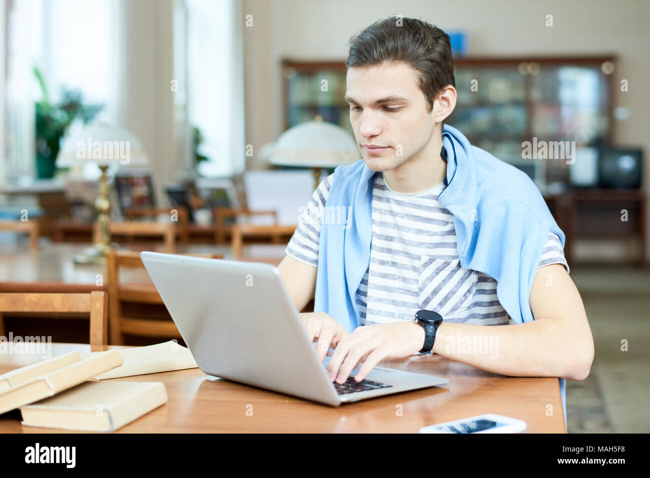 Student boy library hi-res stock photography and images - Alamy