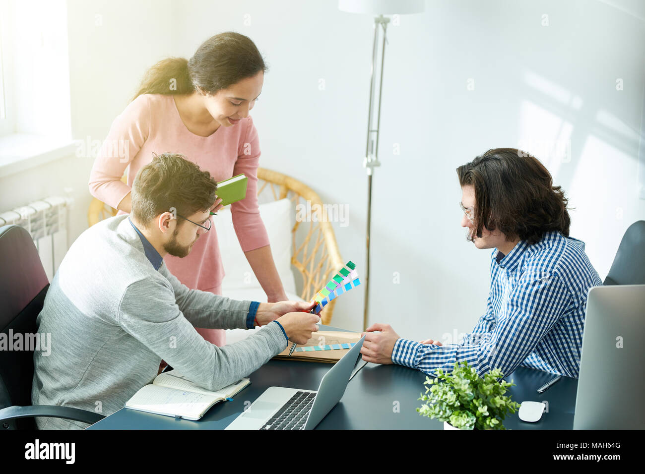 Creative colleagues choosing colors for design Stock Photo - Alamy