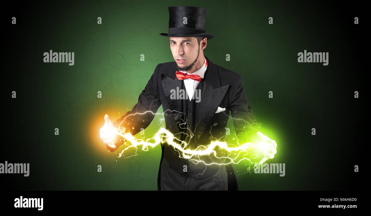 Magician sparkling super power between his two hands Stock Photo - Alamy