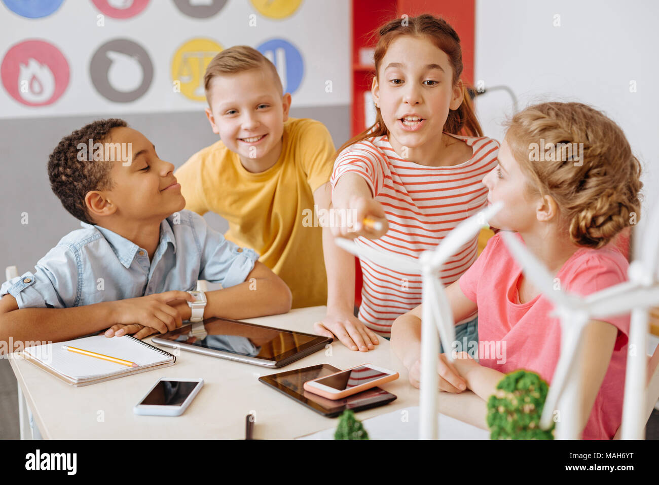 Kids discussing and idea at school hi-res stock photography and images ...