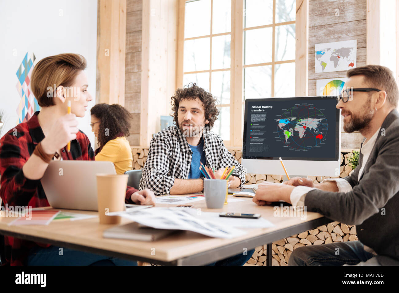 Serious man discussing work his co-workers Stock Photo - Alamy
