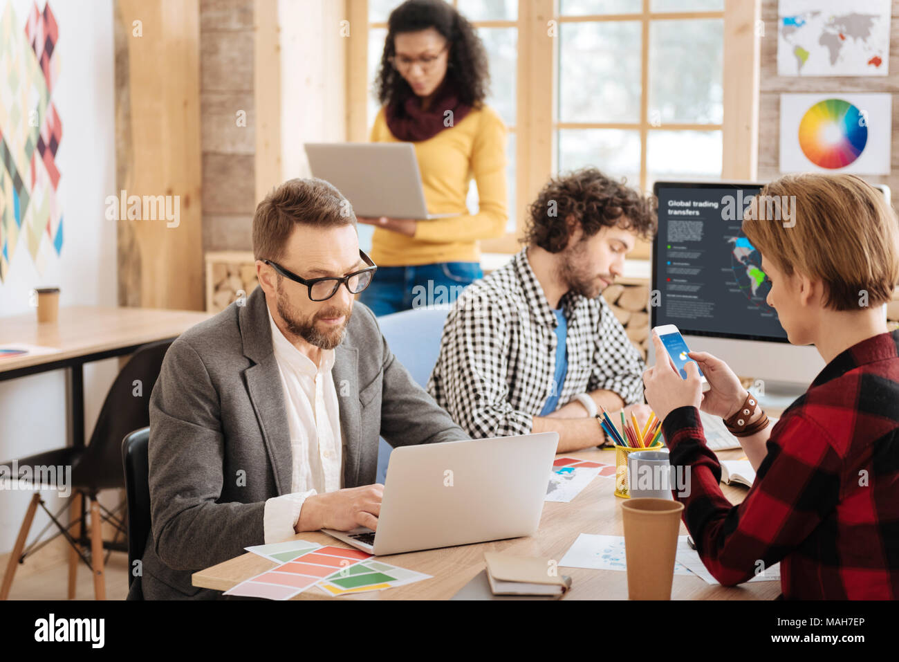 Concentrated employees doing their job Stock Photo - Alamy