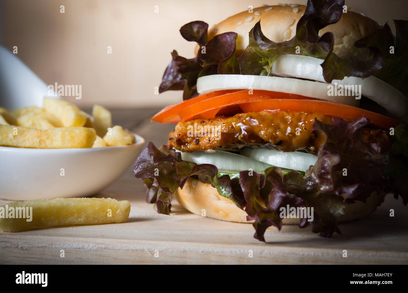 Close up of Rustic homemade hamburger and french fries Stock Photo - Alamy
