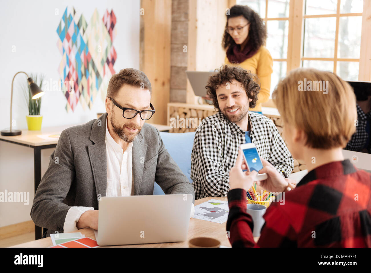 Inspired employees doing their job Stock Photo - Alamy