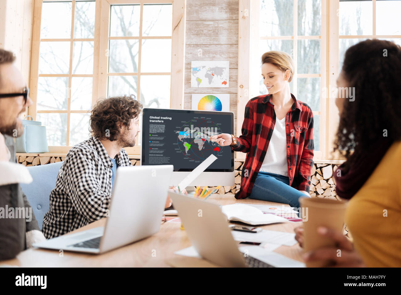 Happy woman reporting work results Stock Photo - Alamy