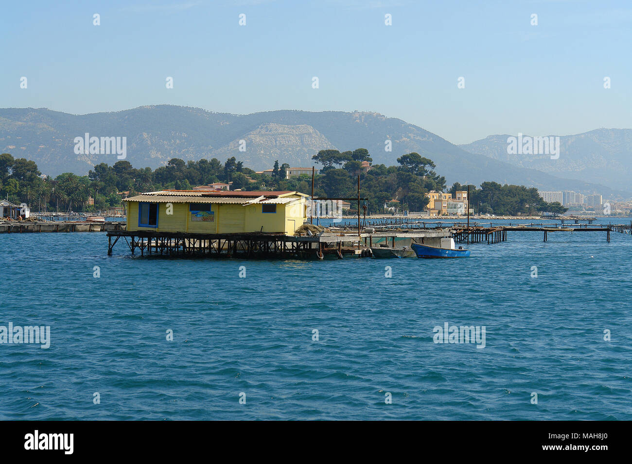 Small wood houses of fish farming Stock Photo - Alamy