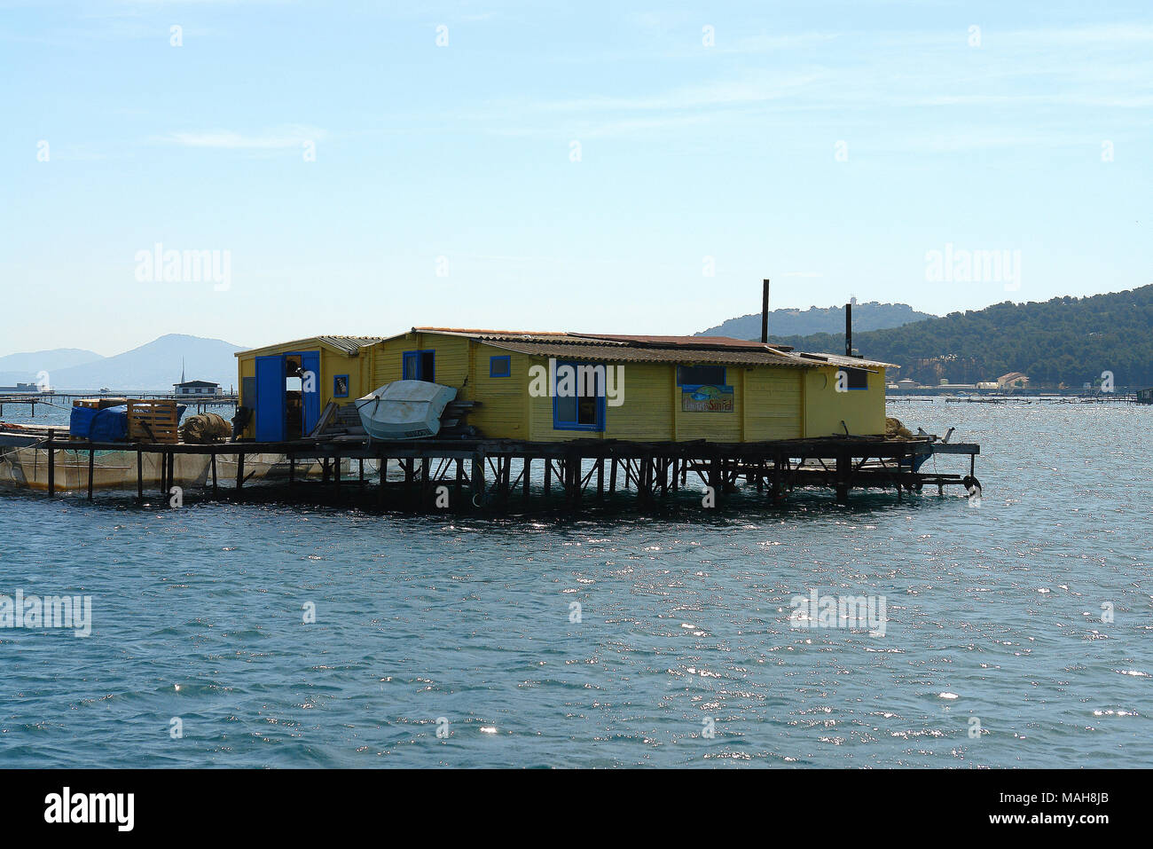 Small wood houses of fish farming Stock Photo - Alamy