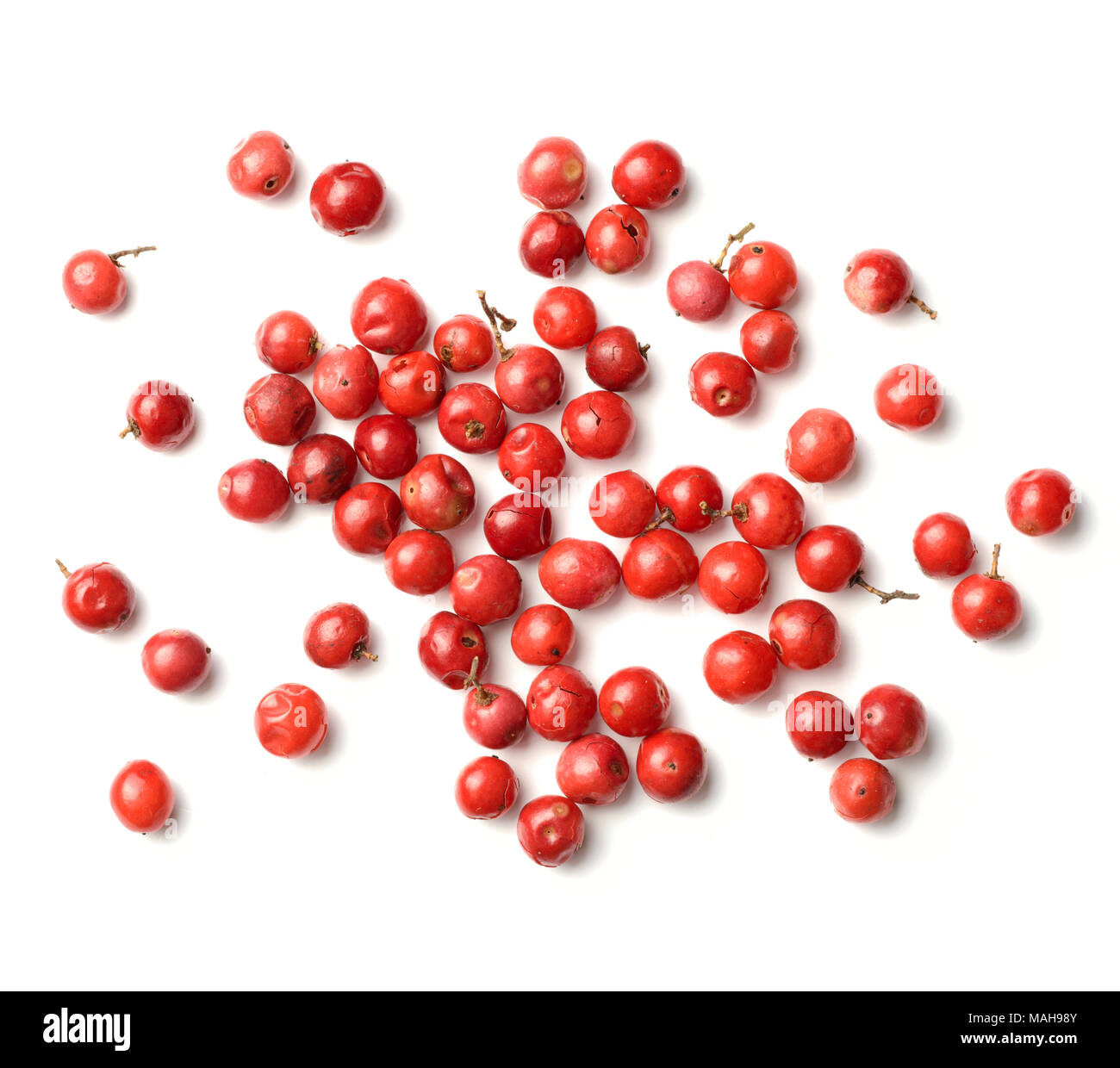 dried pink peppercorns isolated on white background Stock Photo - Alamy