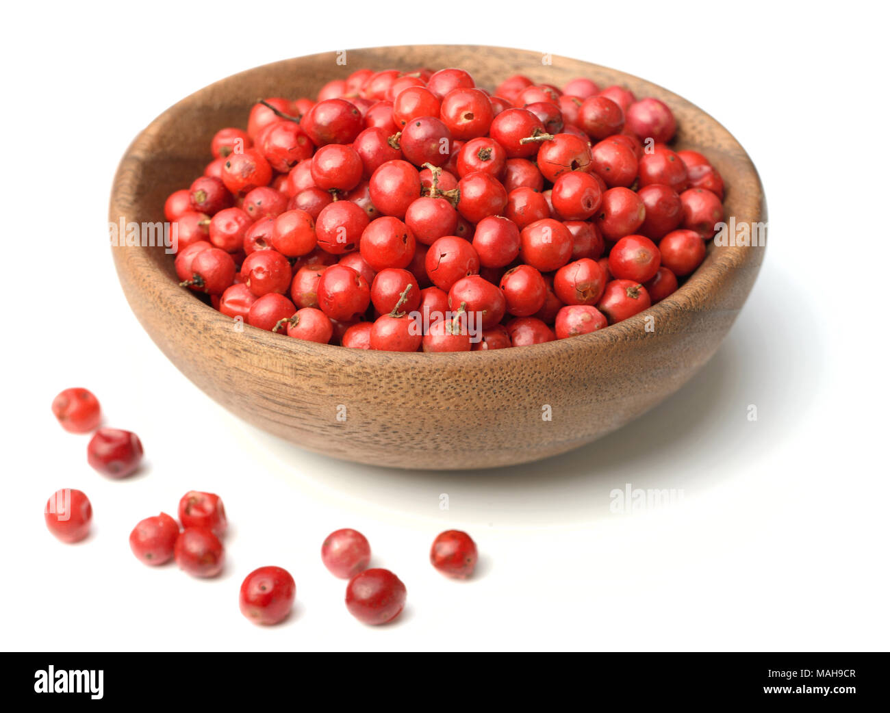 dried pink peppercorns isolated on white background Stock Photo - Alamy