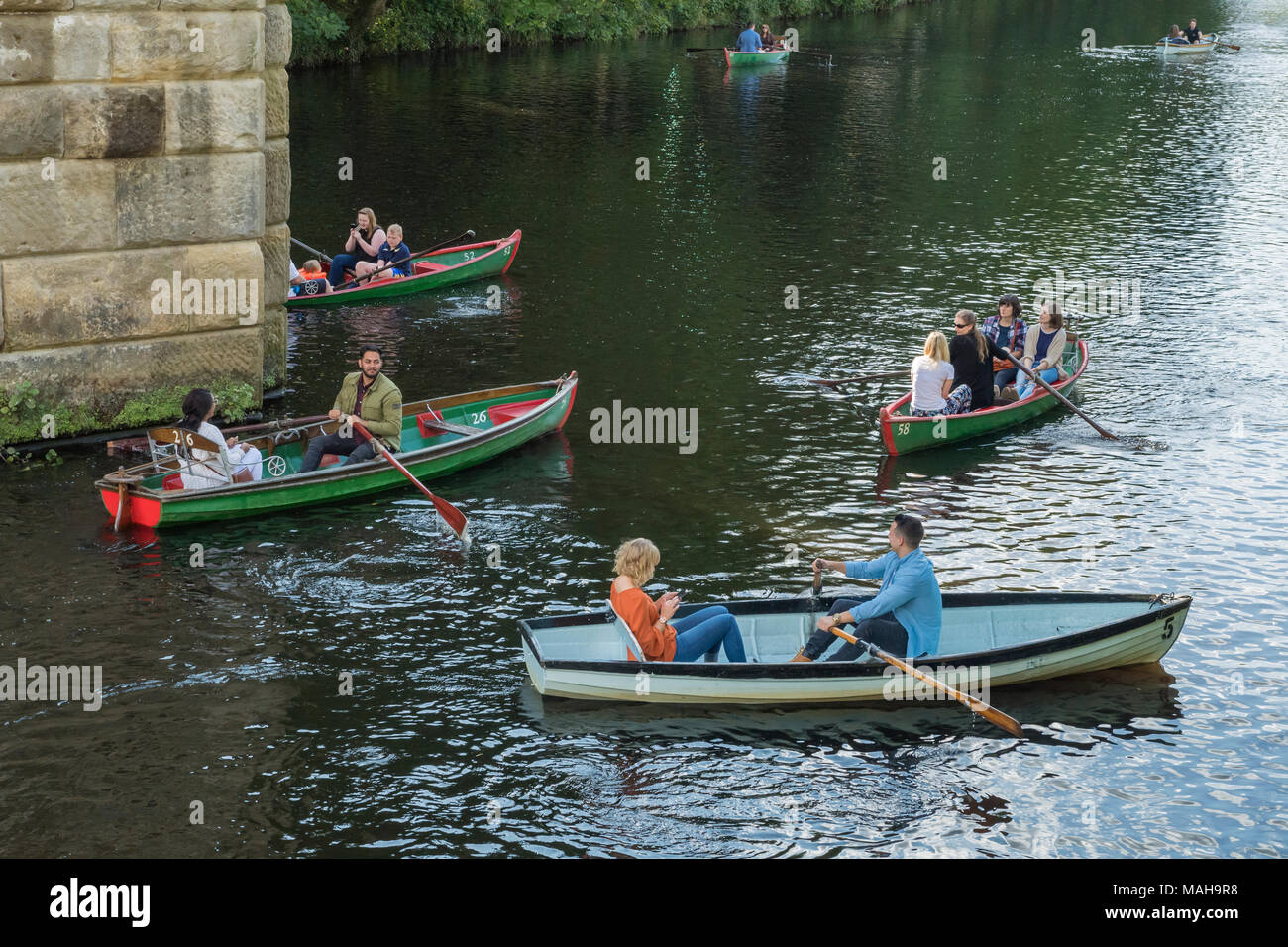 People on holiday (families, friends, couples) relaxing & having fun ...