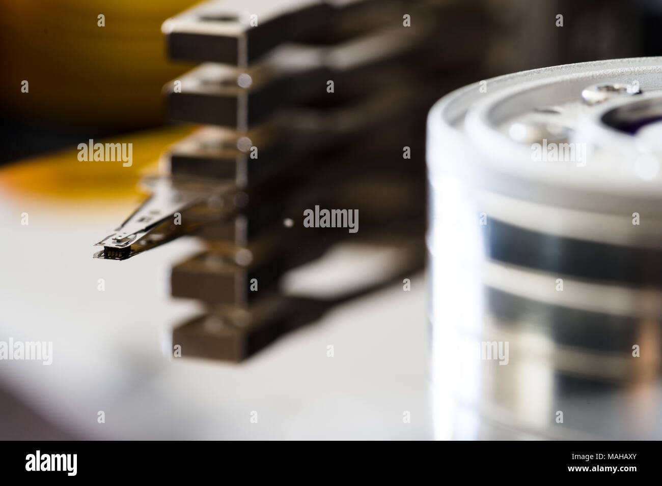 Hard disk drive inside close-up, spindle, actuator arm, read write head ...