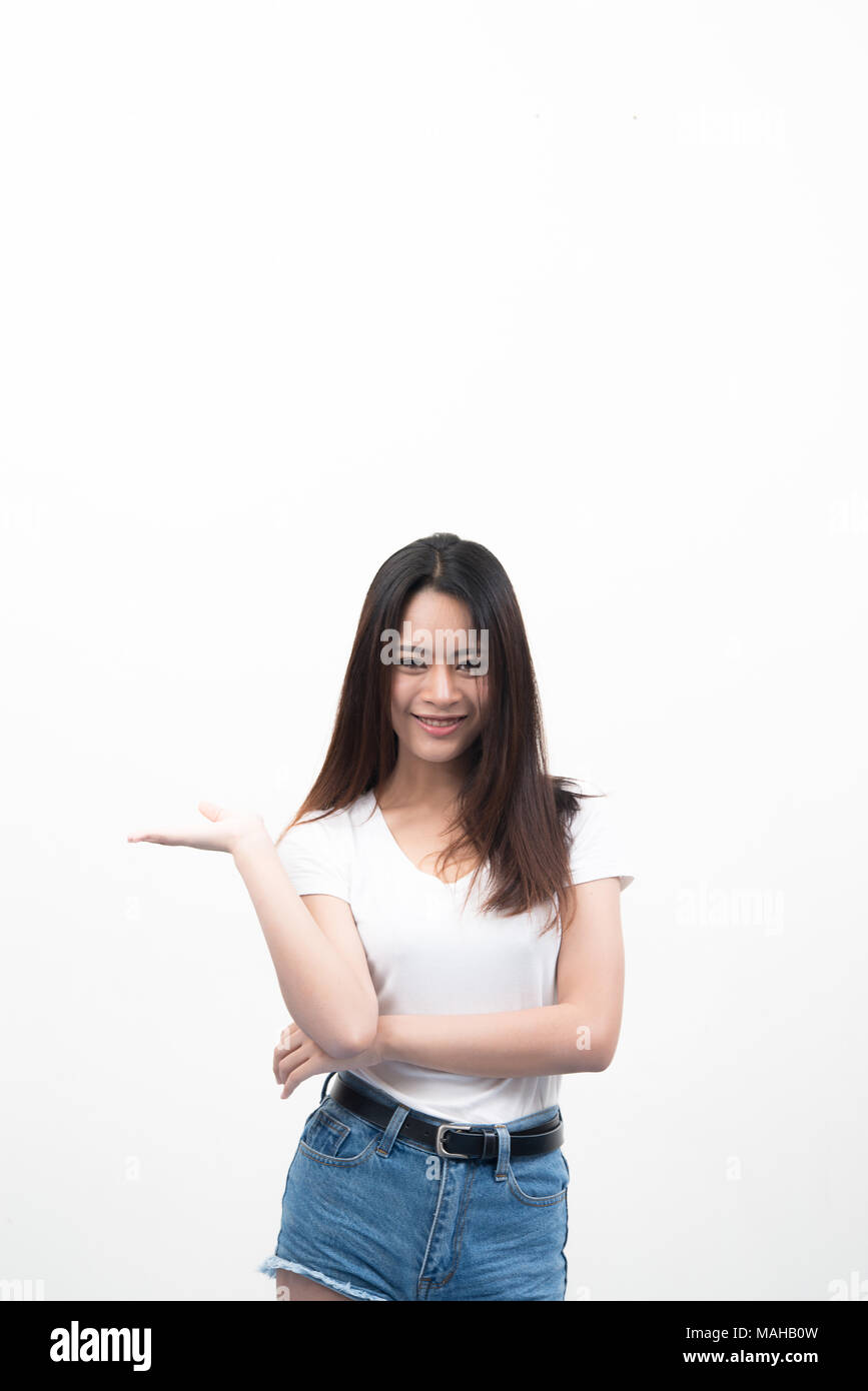 Beautiful young asian woman with hand showing for advertising isolated ...