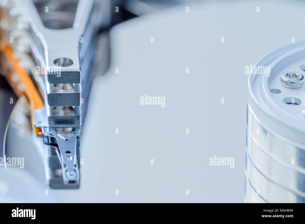 Hard disk drive inside close-up, spindle, actuator arm, read write head ...
