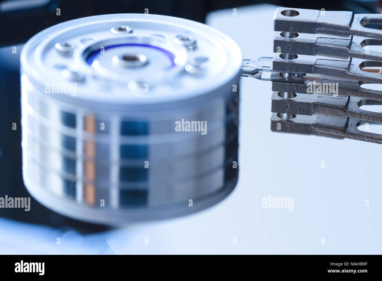 Hard disk drive inside close-up, spindle, actuator arm, read write head ...
