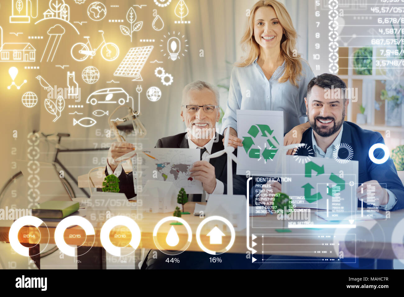 Emotional engineers holding recycling signs and looking happy Stock ...