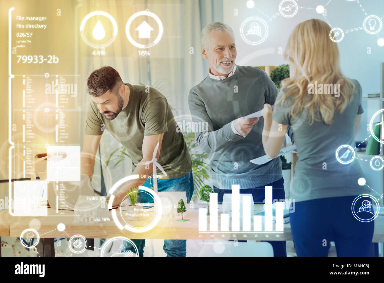 Happy engineer smiling while giving documents to his young secretary ...