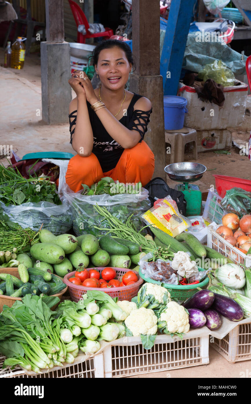 Market stall and woman stallholder selling vegetable, Kampong Thom ...