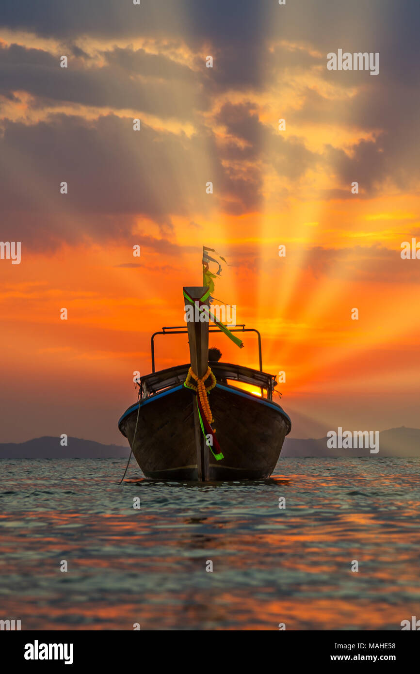 Traditional long-tail boat on the beach Stock Photo - Alamy