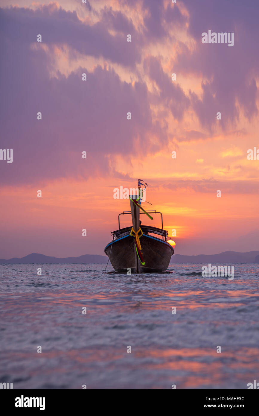 Traditional long-tail boat on the beach Stock Photo - Alamy