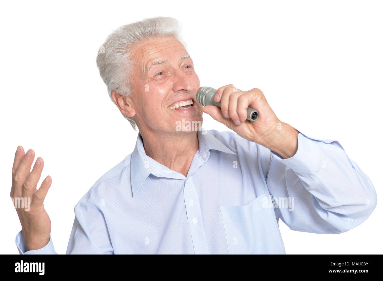 Portrait of senior man singing karaoke Stock Photo - Alamy