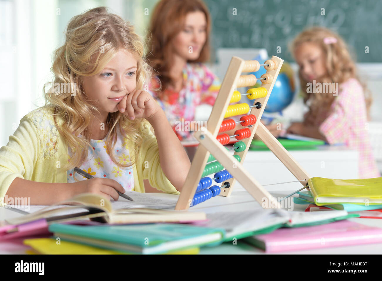 Girls education lesson class globe hi-res stock photography and images ...