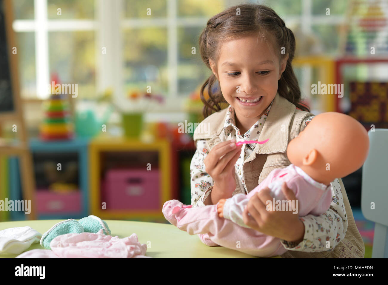 girl playing with doll Stock Photo - Alamy