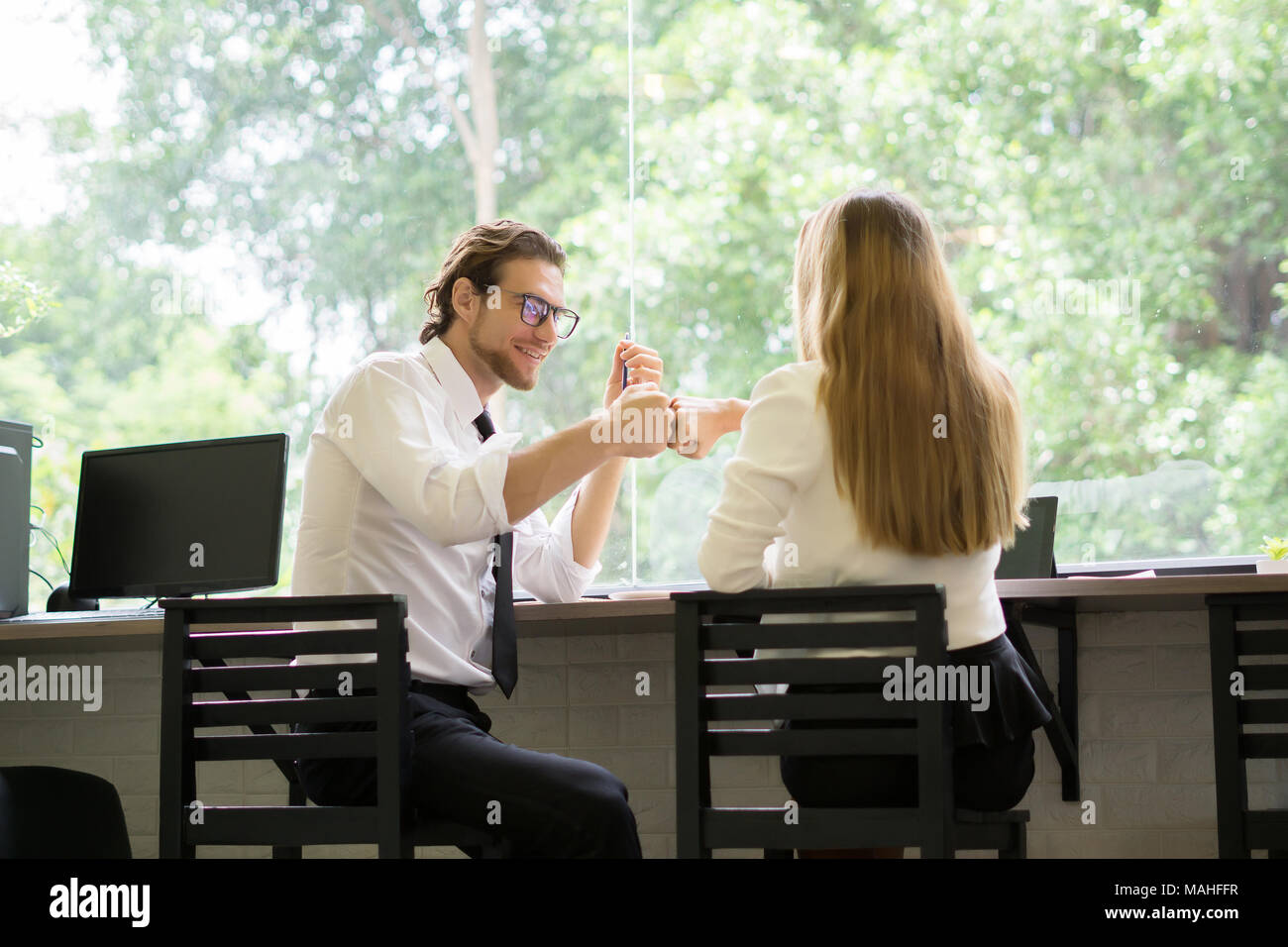 Happy colleagues have meeting together while working at office Stock ...