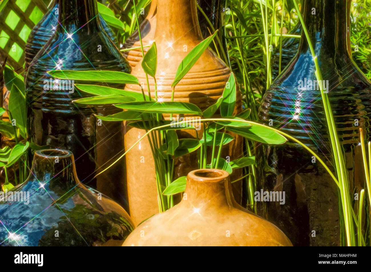 Pots arranged in a garden reflecting the sunlight Stock Photo - Alamy