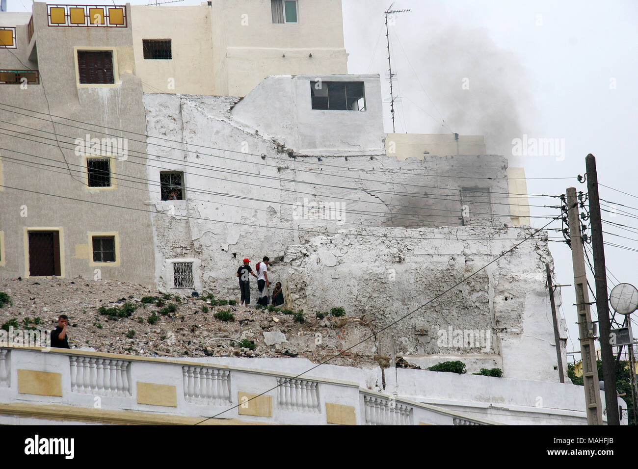 Group of young men playing in smoky rubble Tangiers Stock Photo - Alamy