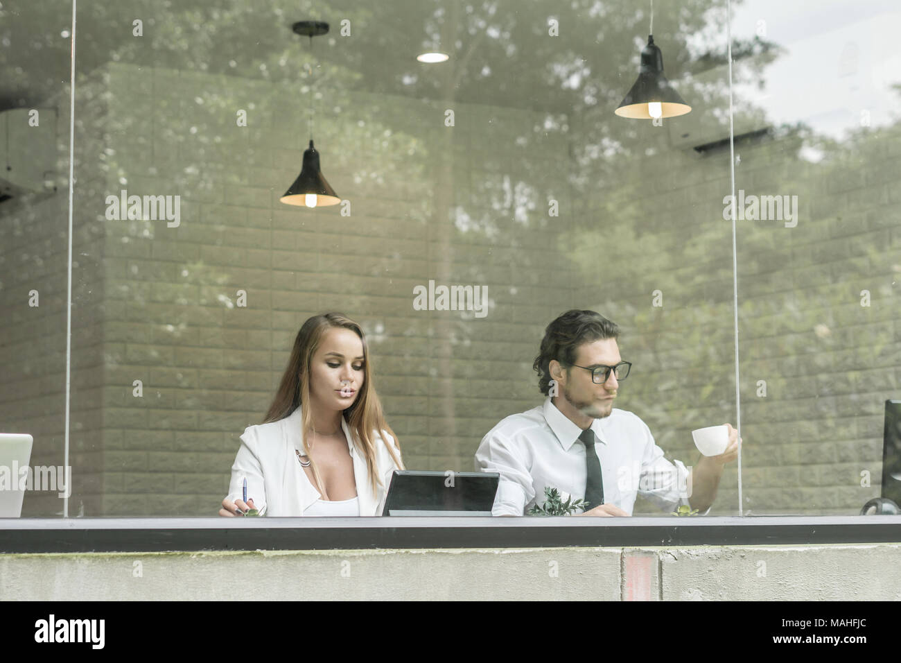 Happy colleagues have meeting together while working at office Stock ...