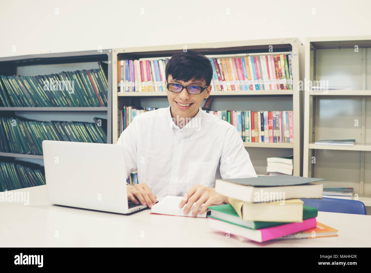 Student making research on laptop and browse internet. Education ...