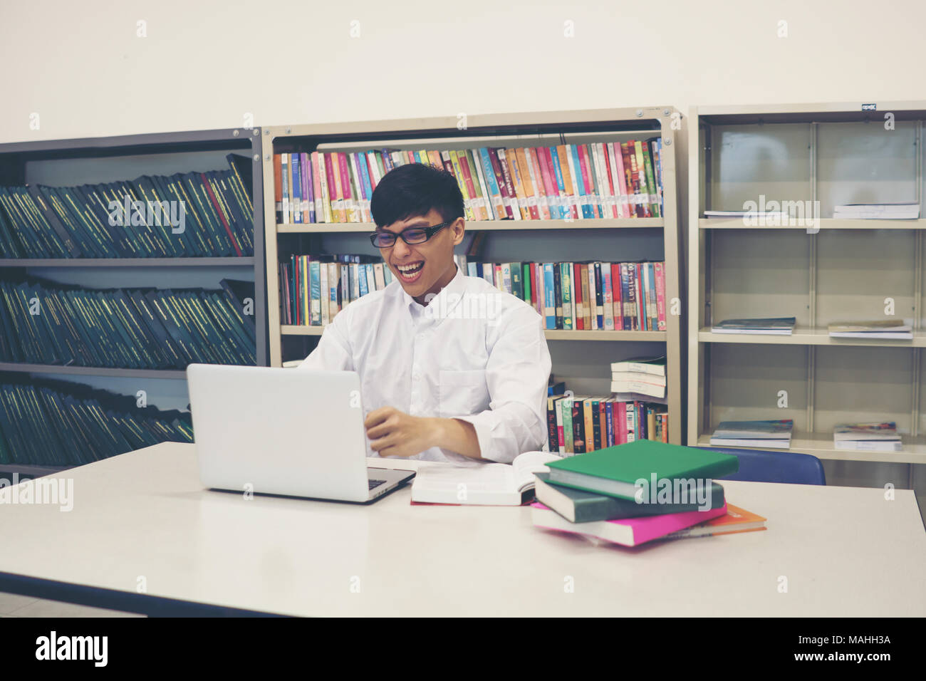 Student making research on laptop and browse internet. Education ...