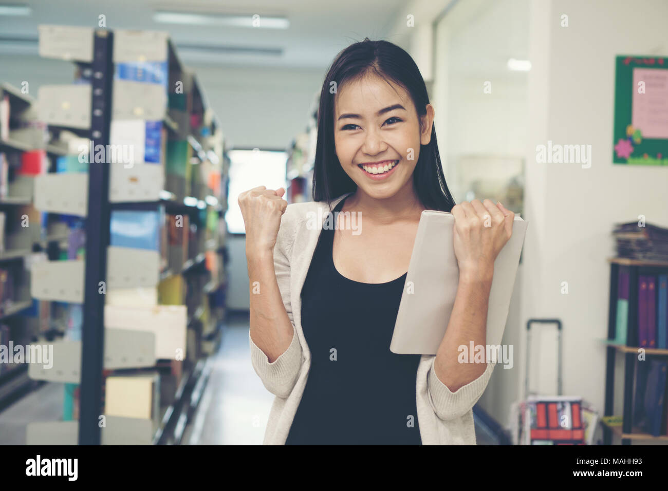 Happy student at library. Education concept Stock Photo - Alamy