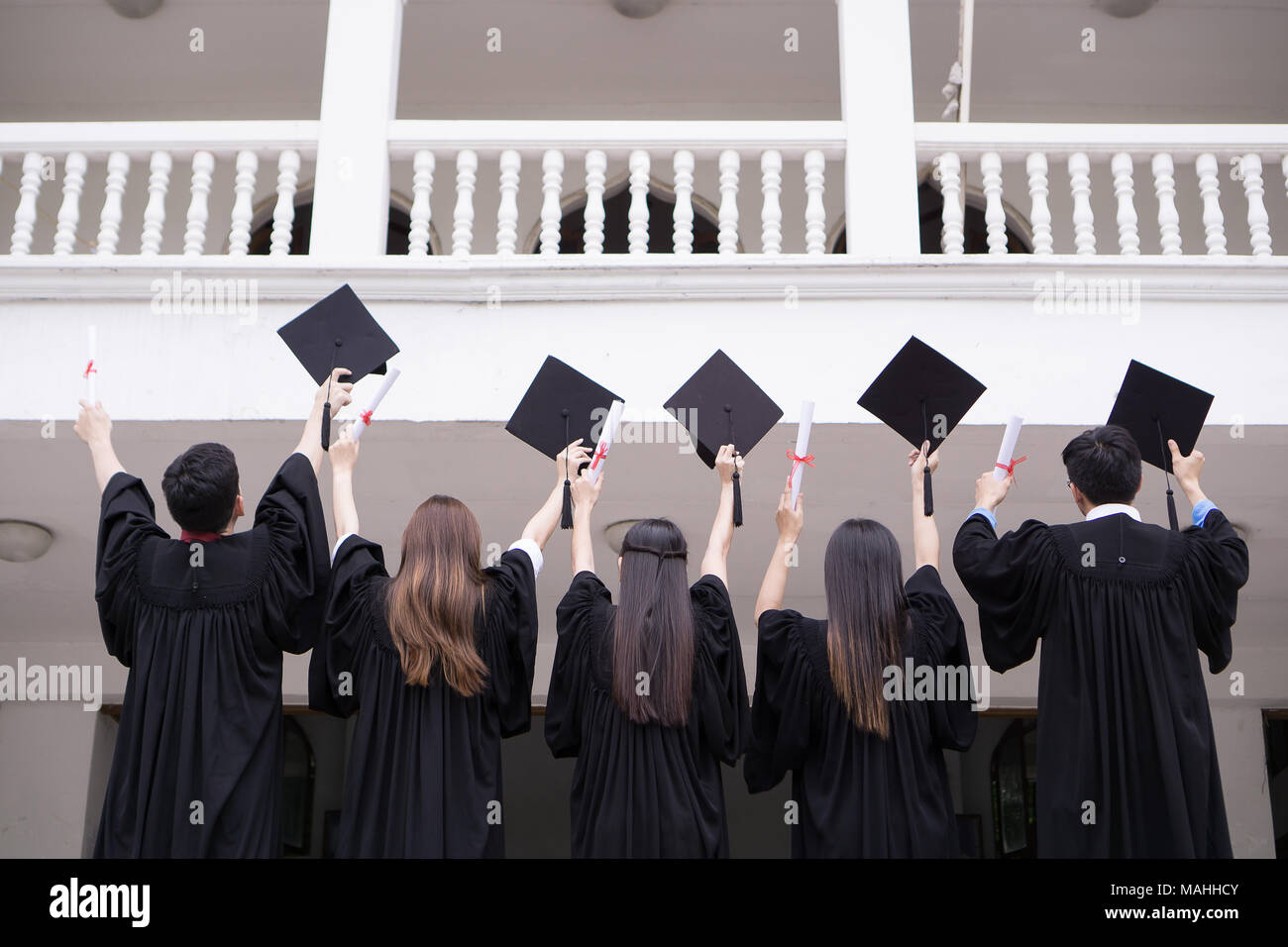 Cheerful students celebrating graduation ceremony hi-res stock ...